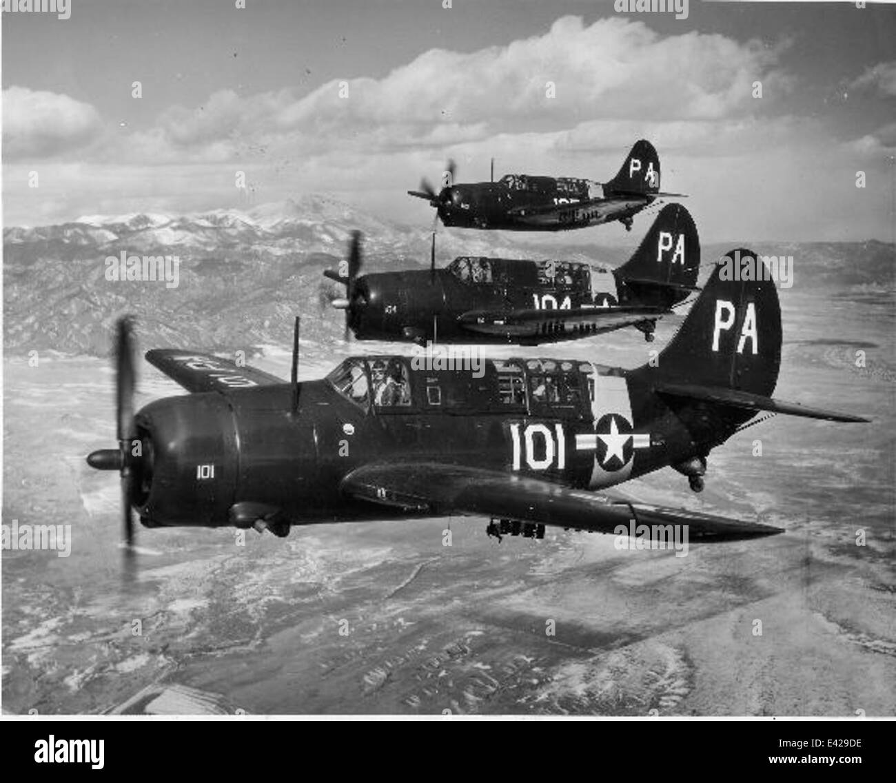 This image captures an SB2C-5 Helldiver, a carrier-based dive bomber ...