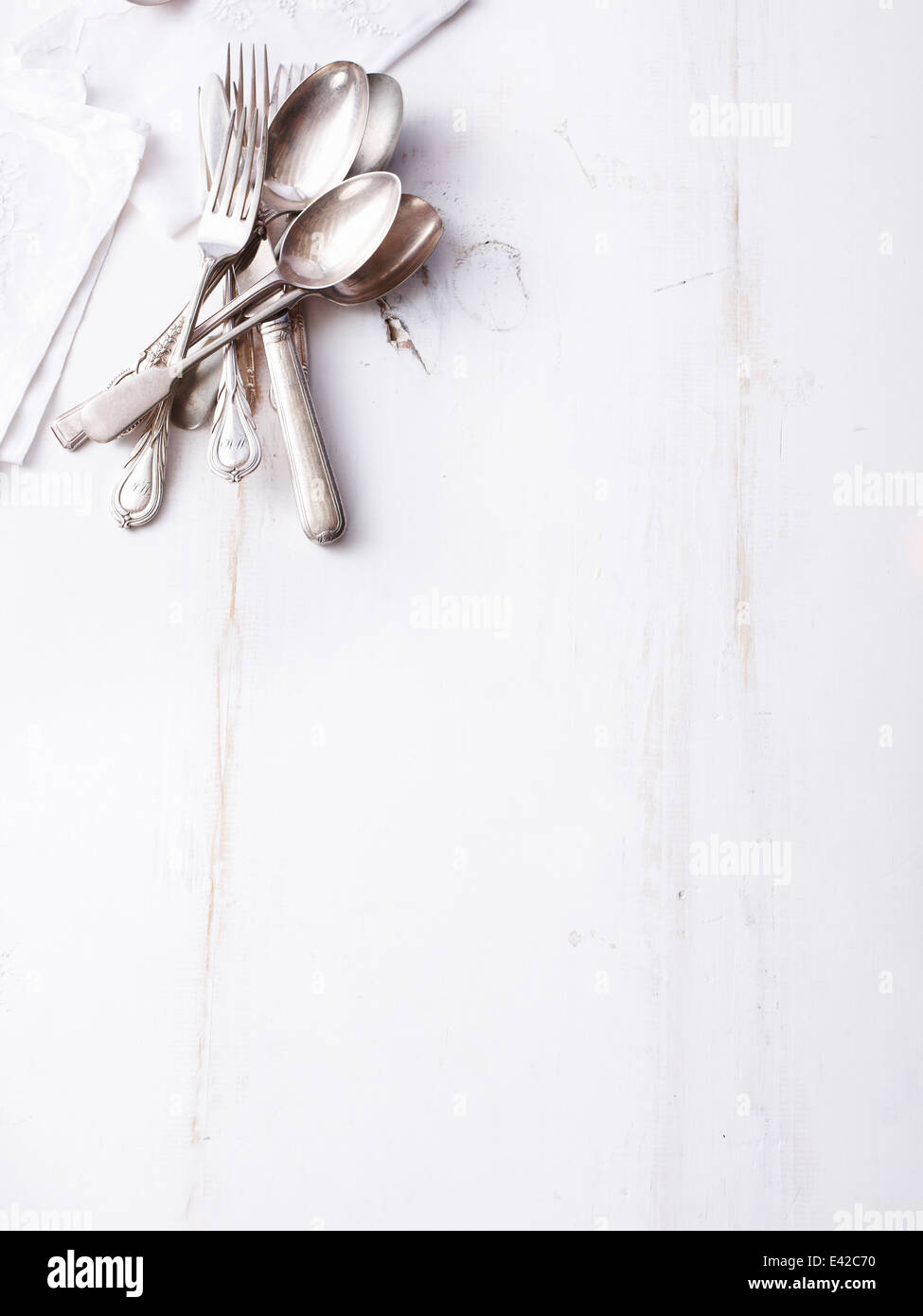 Still life of traditional cutlery on empty table Stock Photo - Alamy