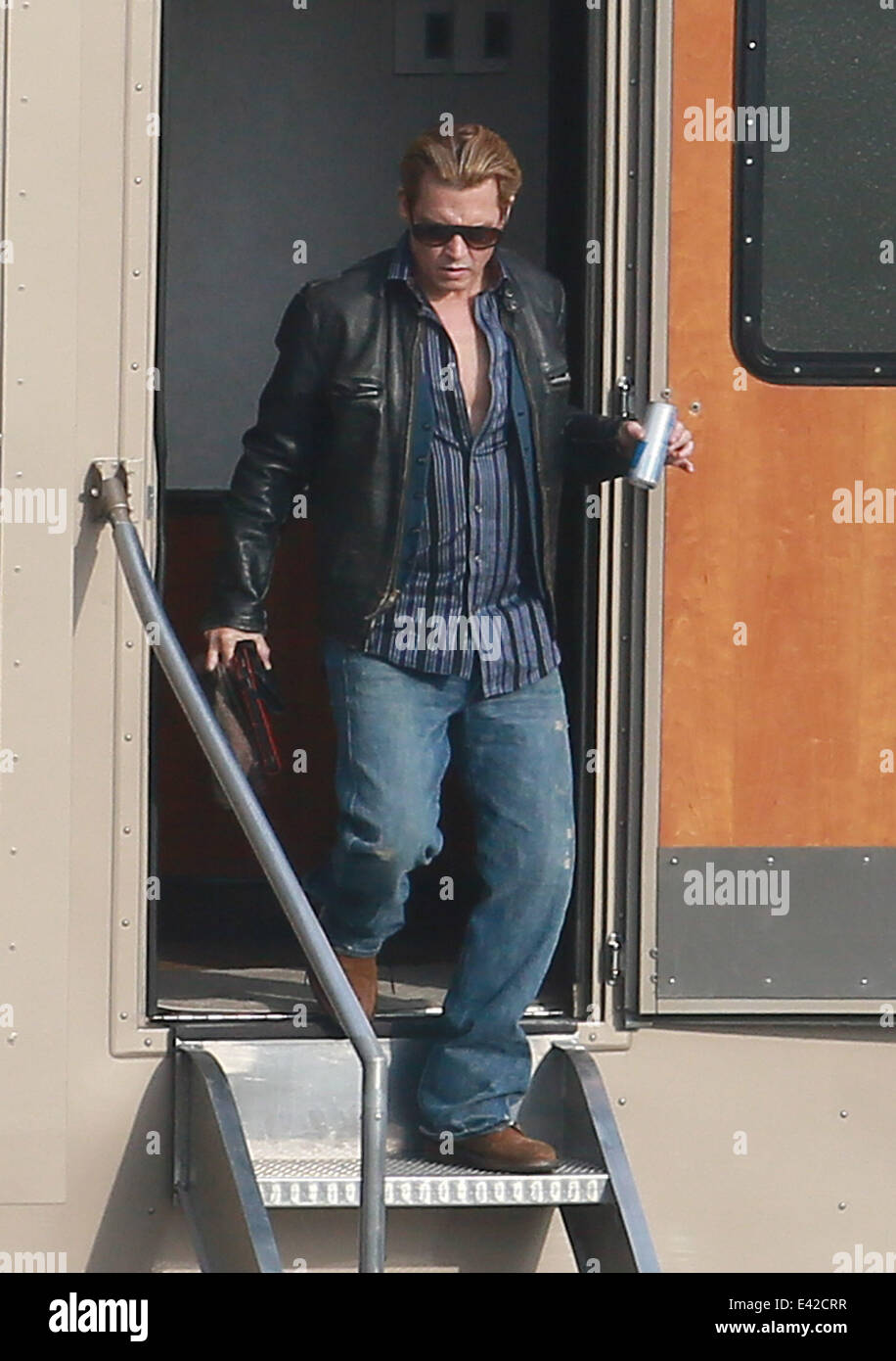 A clean shaven Johnny Depp shows a bit of paunch while leaving his ...