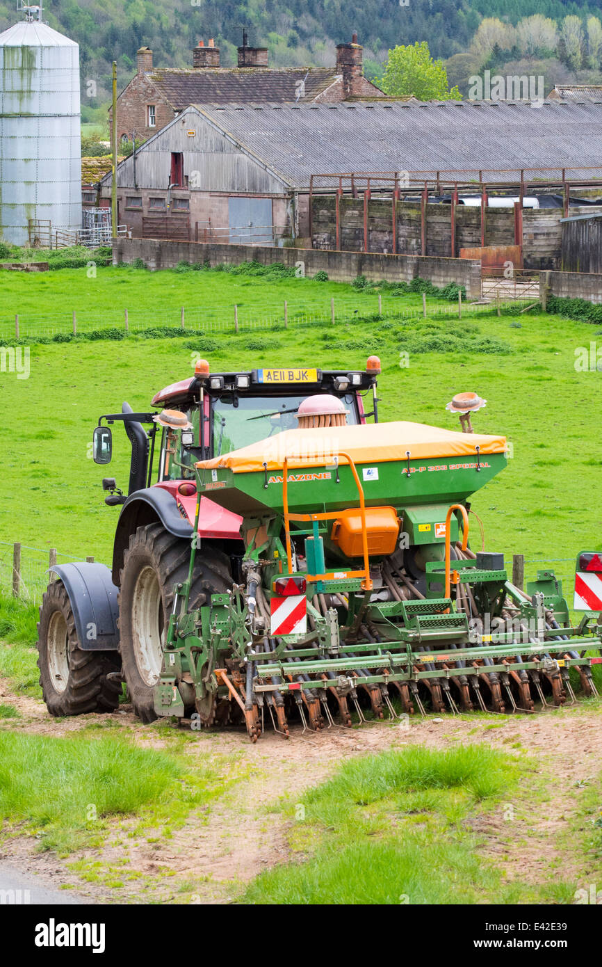 A seed drilling rig on the back of a tractor at a farm in Kirkoswold in ...
