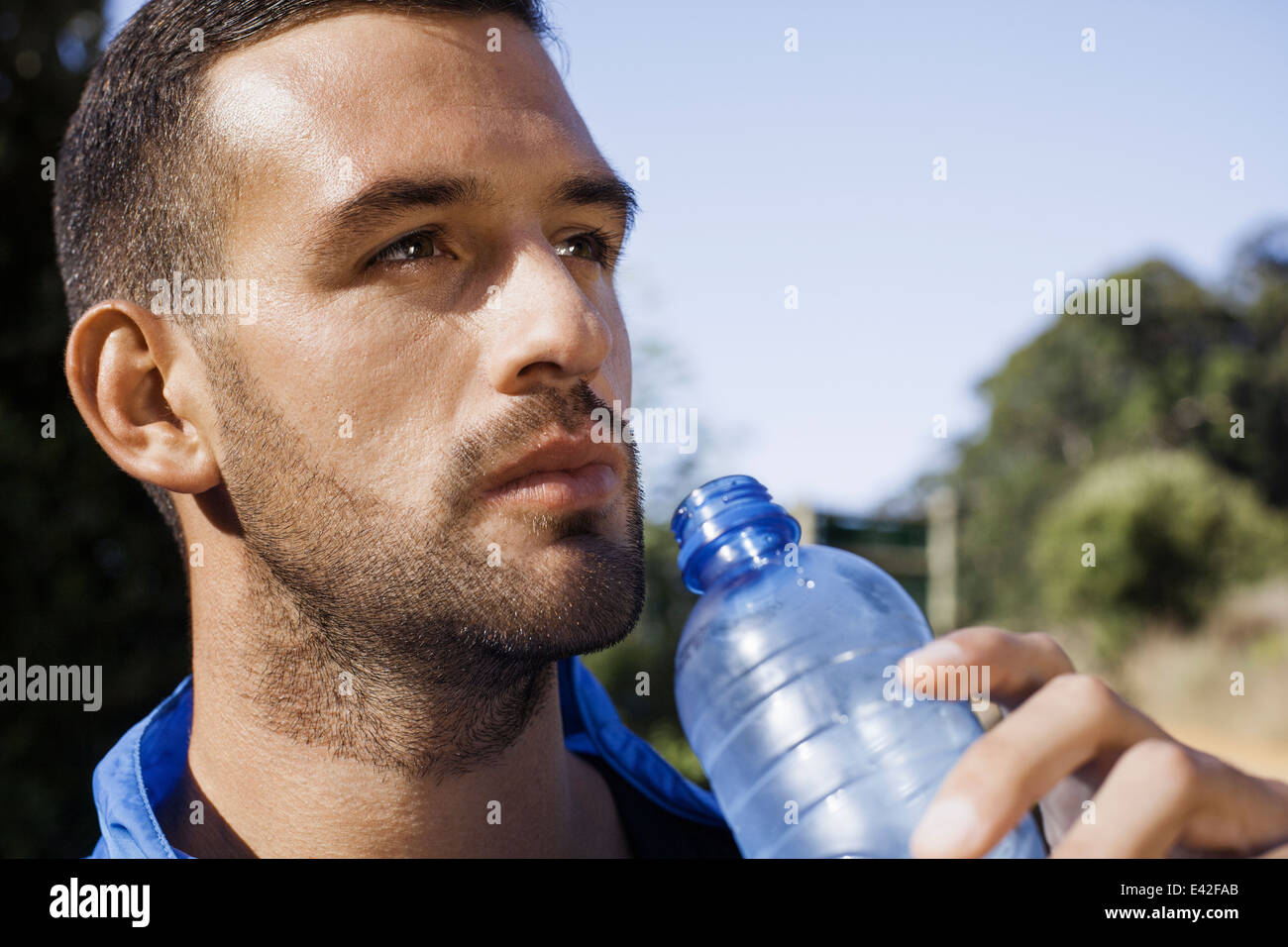 Holding up bottle hi-res stock photography and images - Alamy