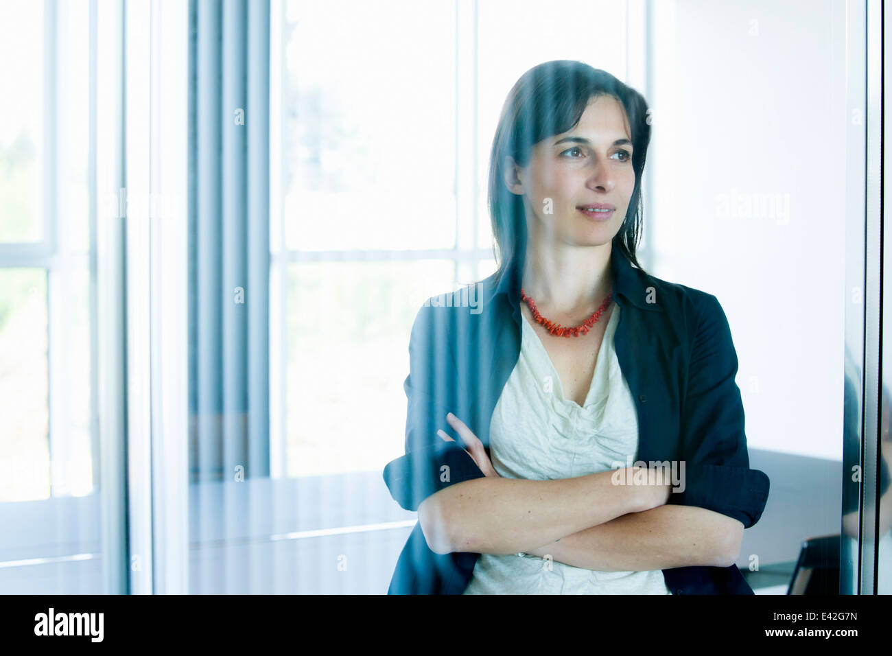 Person behind glass hi-res stock photography and images - Alamy