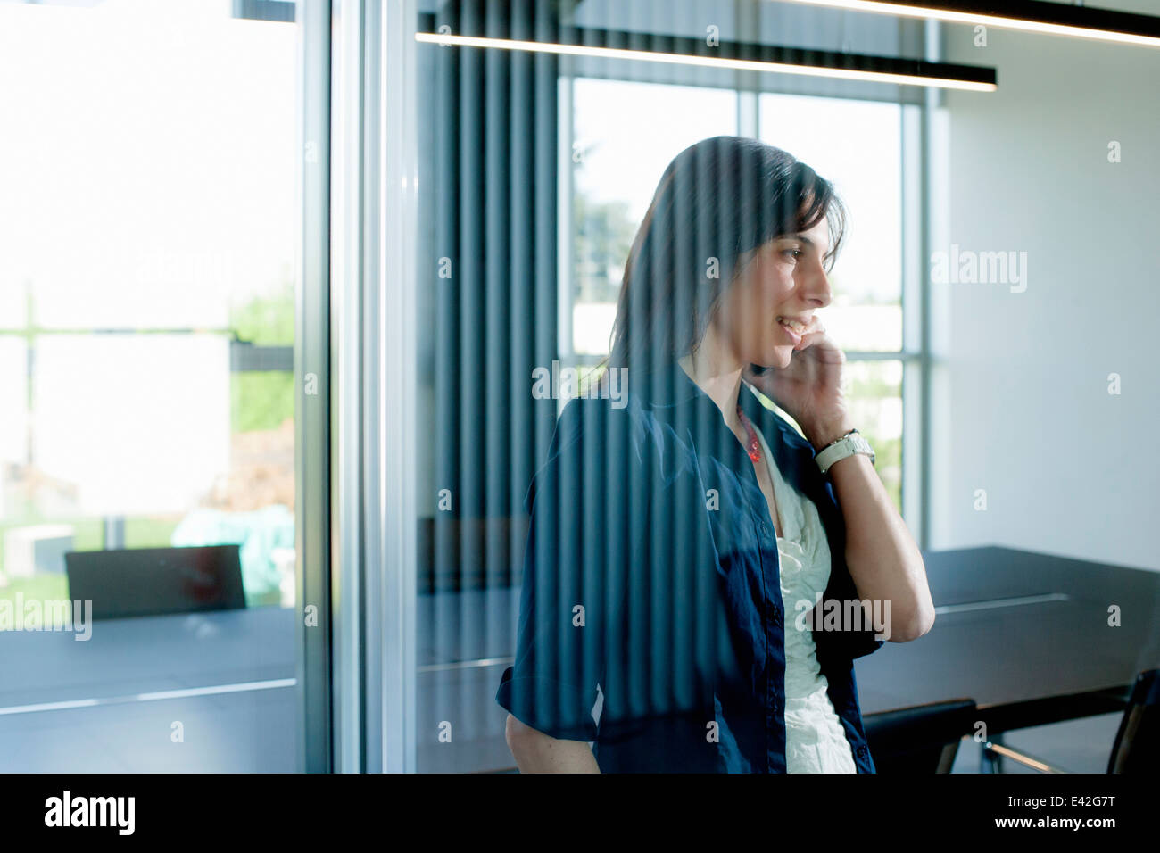 Person behind glass hi-res stock photography and images - Alamy