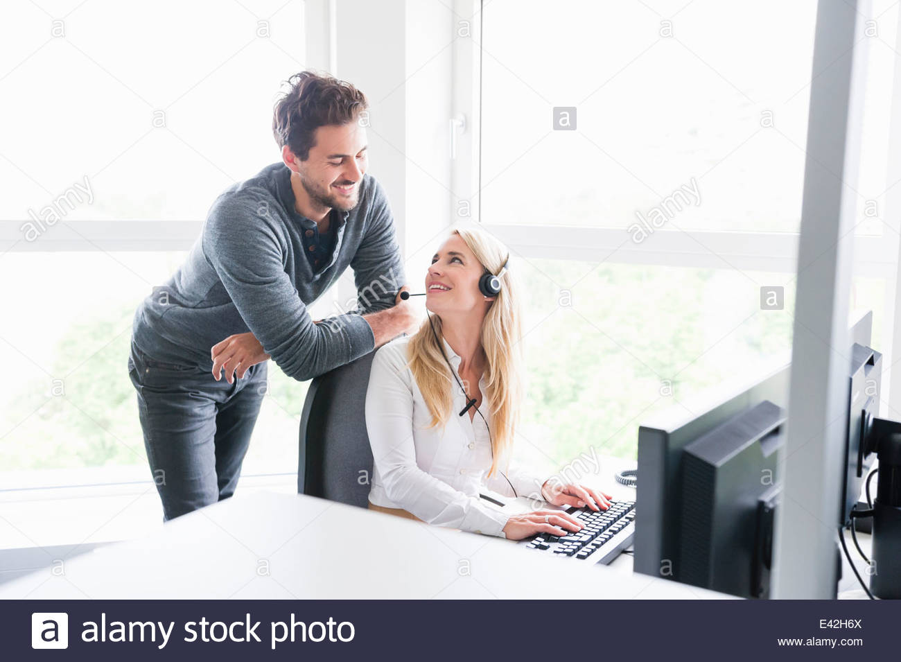 Woman Looking Over Shoulder Man Stock Photos & Woman Looking Over ...