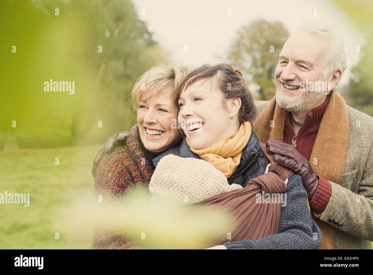Three generation family smiling Stock Photo - Alamy
