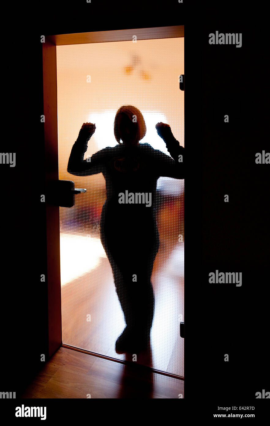 Girl prisoner in her own home Stock Photo - Alamy