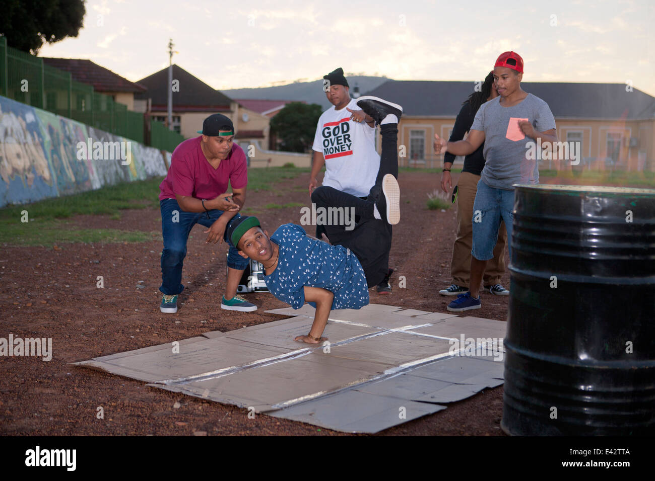 Group of men breakdancing in park at dusk Stock Photo - Alamy