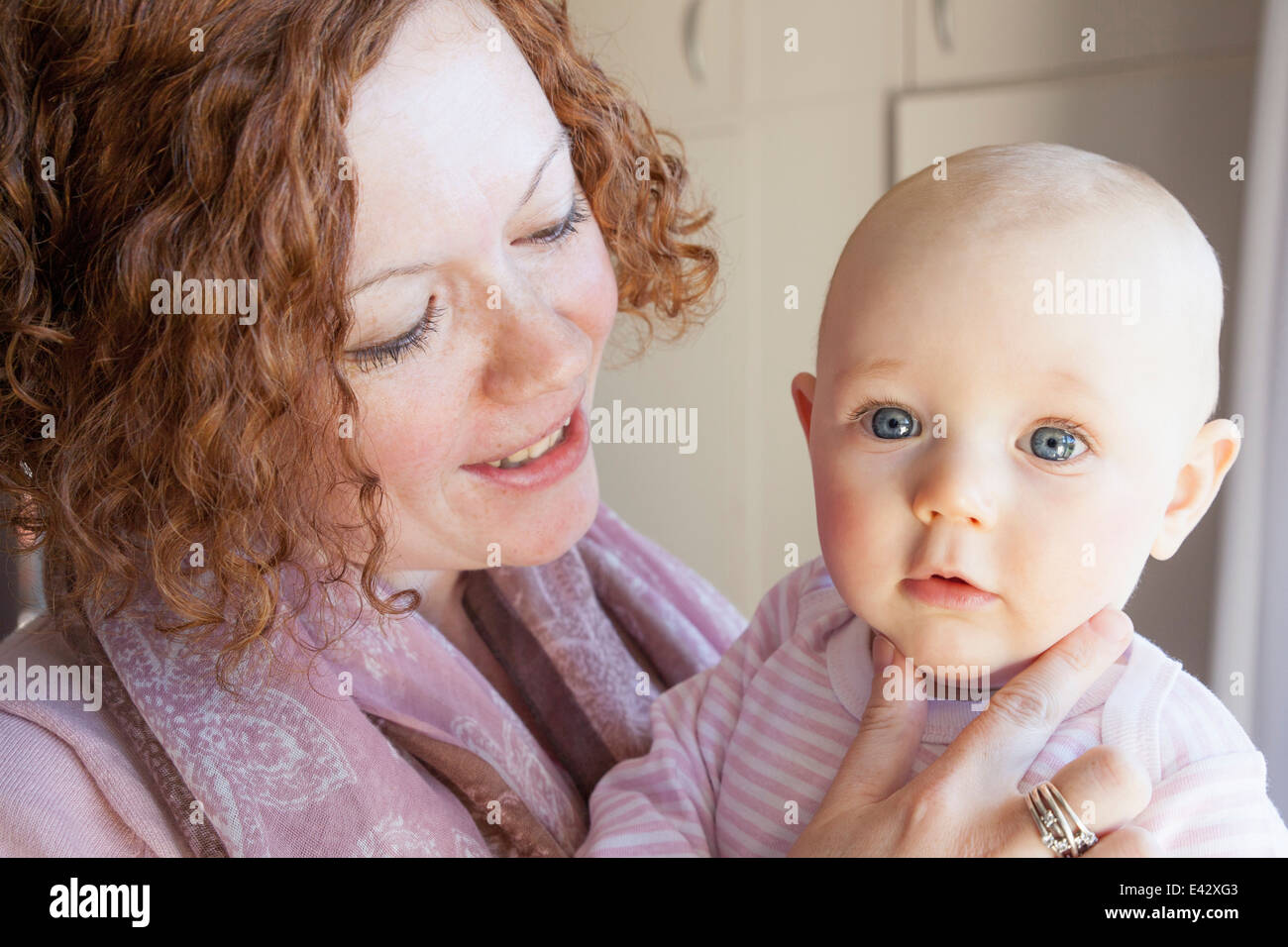 Portrait baby girl and mid adult mother Stock Photo - Alamy