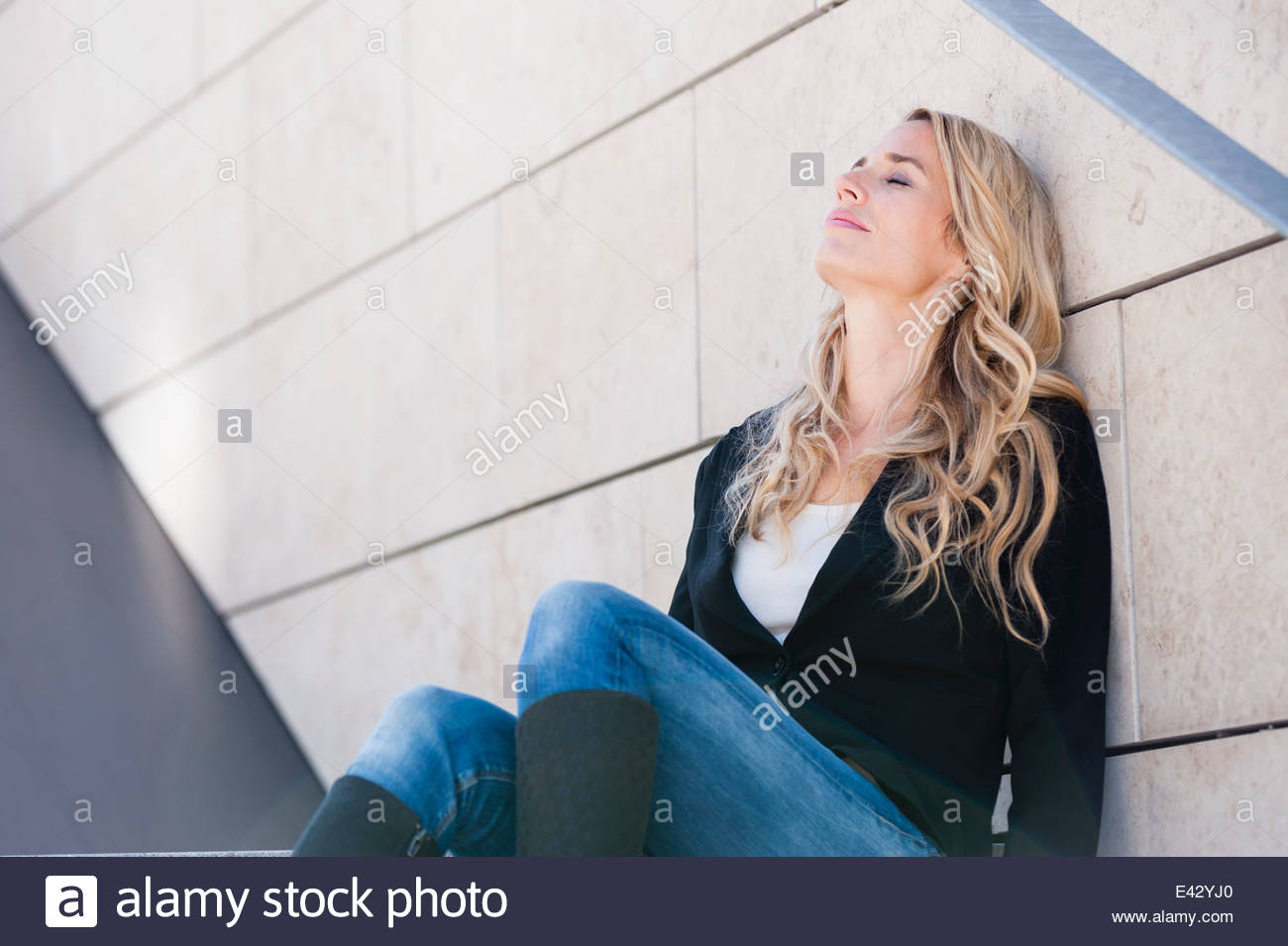 Women Leaning Against Wall On Stock Photos & Women Leaning Against Wall ...