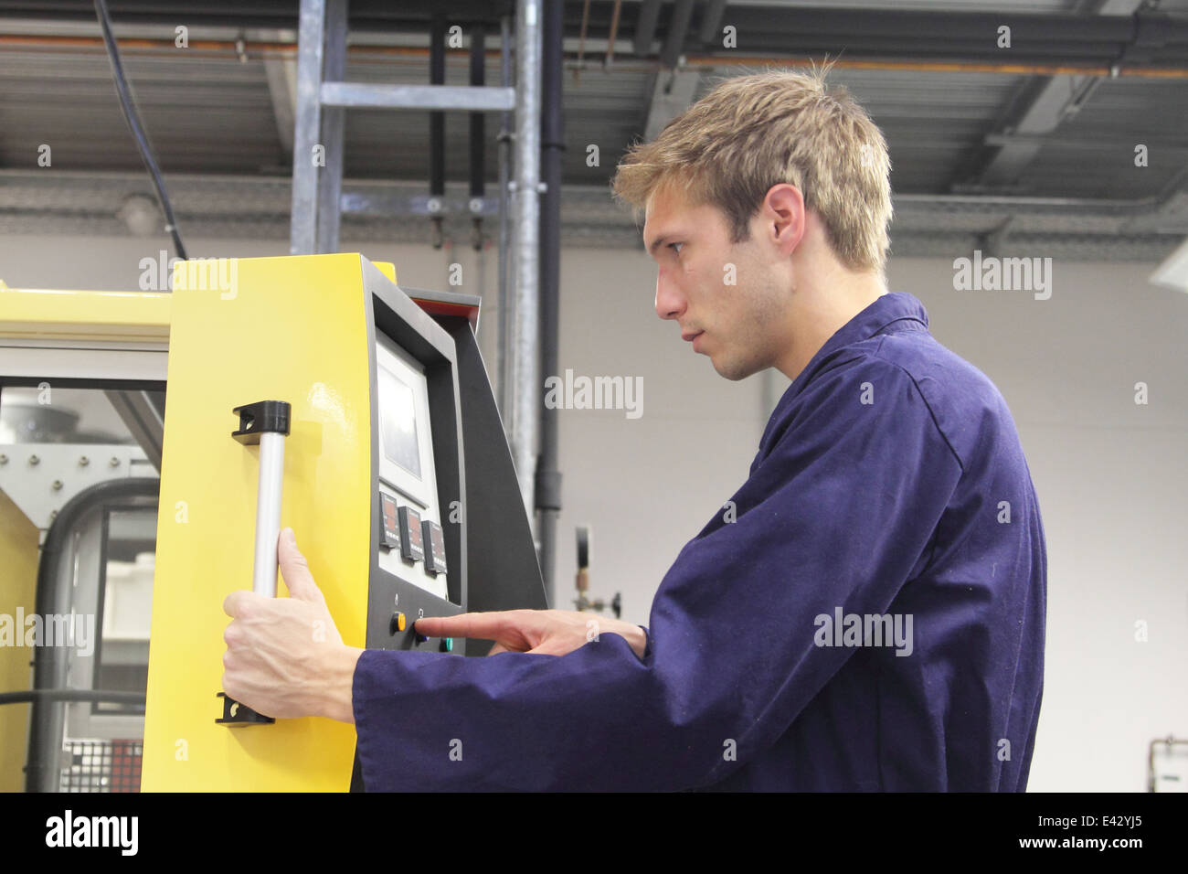 Male engineer testing machine control panel in factory Stock Photo - Alamy