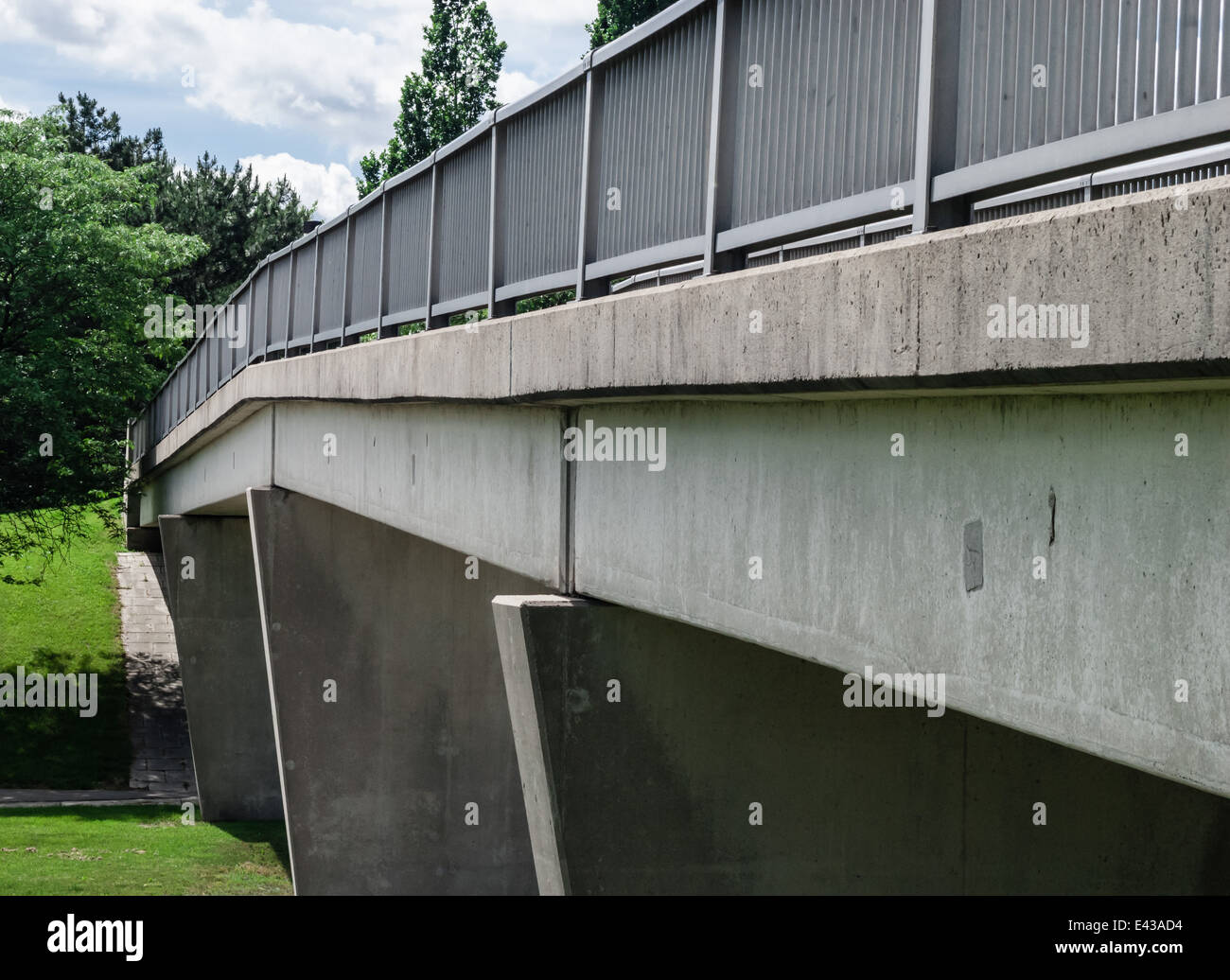 Concrete pedestrian bridge with metal railing in perspective Stock ...
