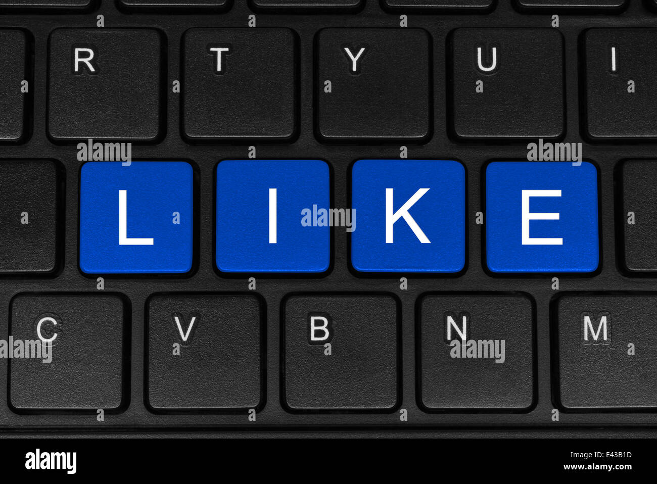 The word like made of four blue buttons of a black keyboard close-up ...