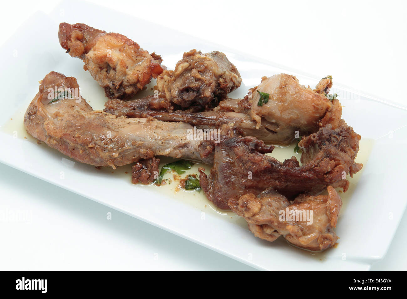 picture of a tasty dish of rabbit with garlic Stock Photo - Alamy
