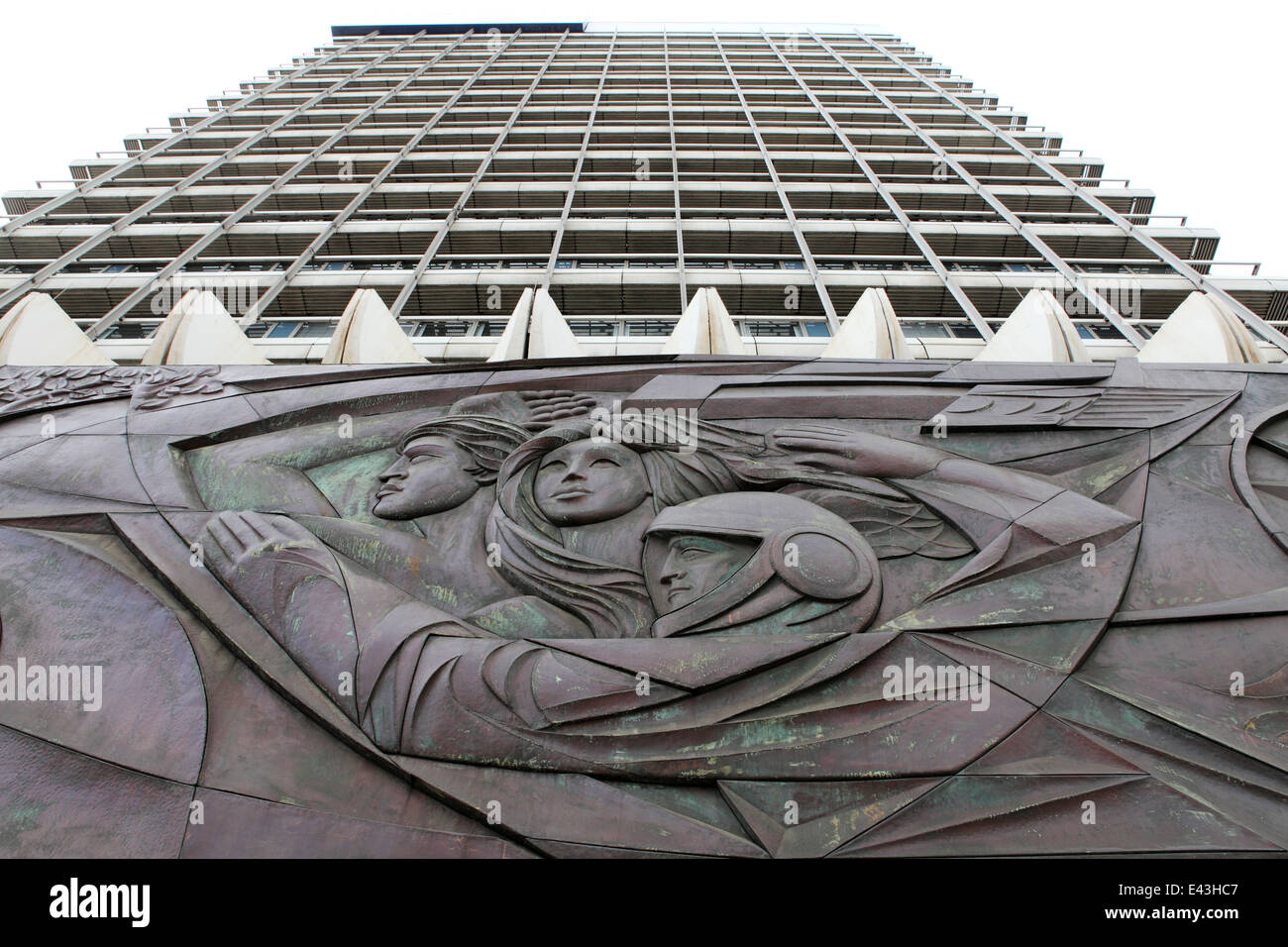 A bas relief sculpture featuring a cosmonaut on a building near ...