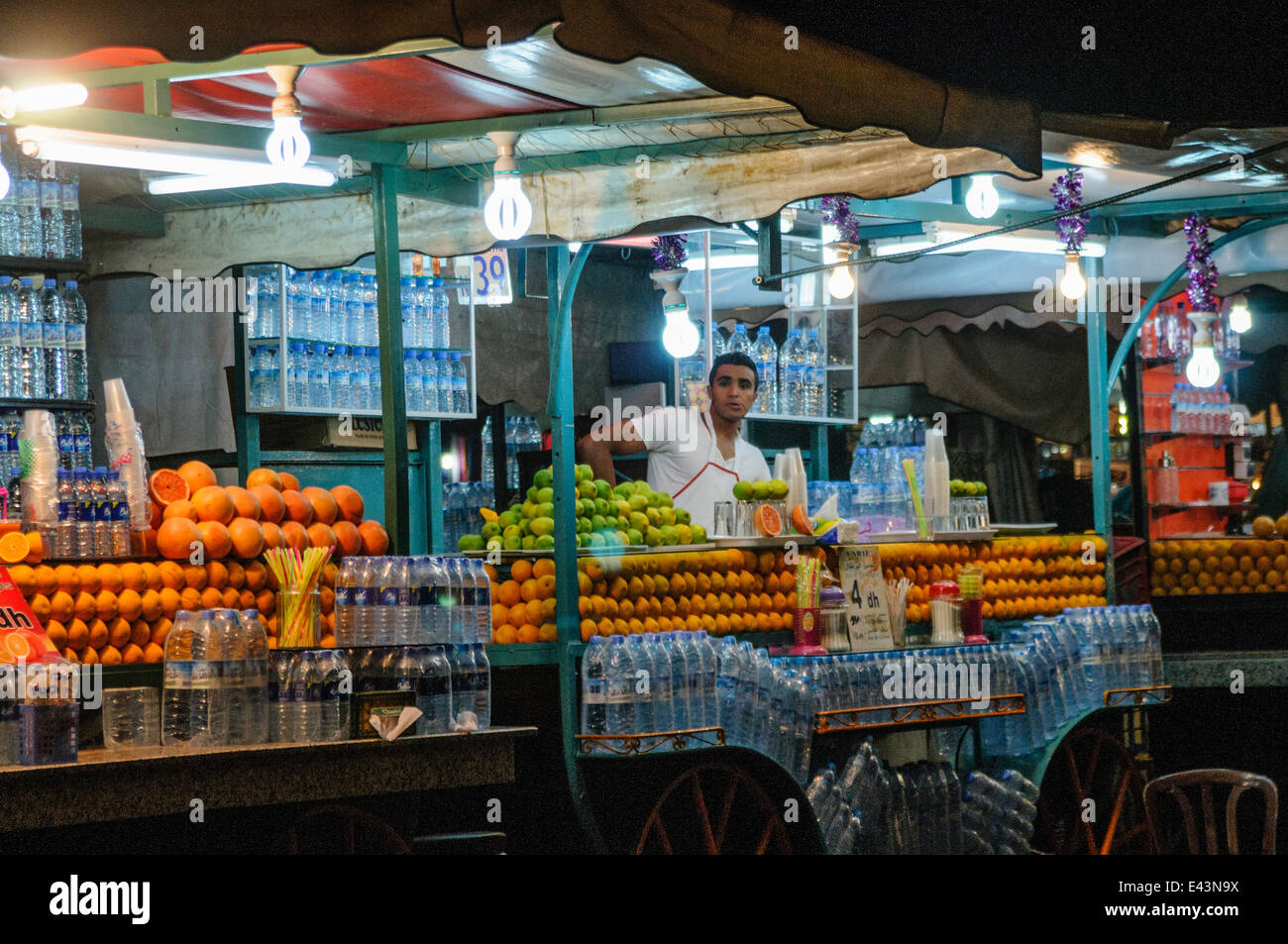 Orange juice seller at the Jemaa El-Fna Fnaa (Big Square) at night ...