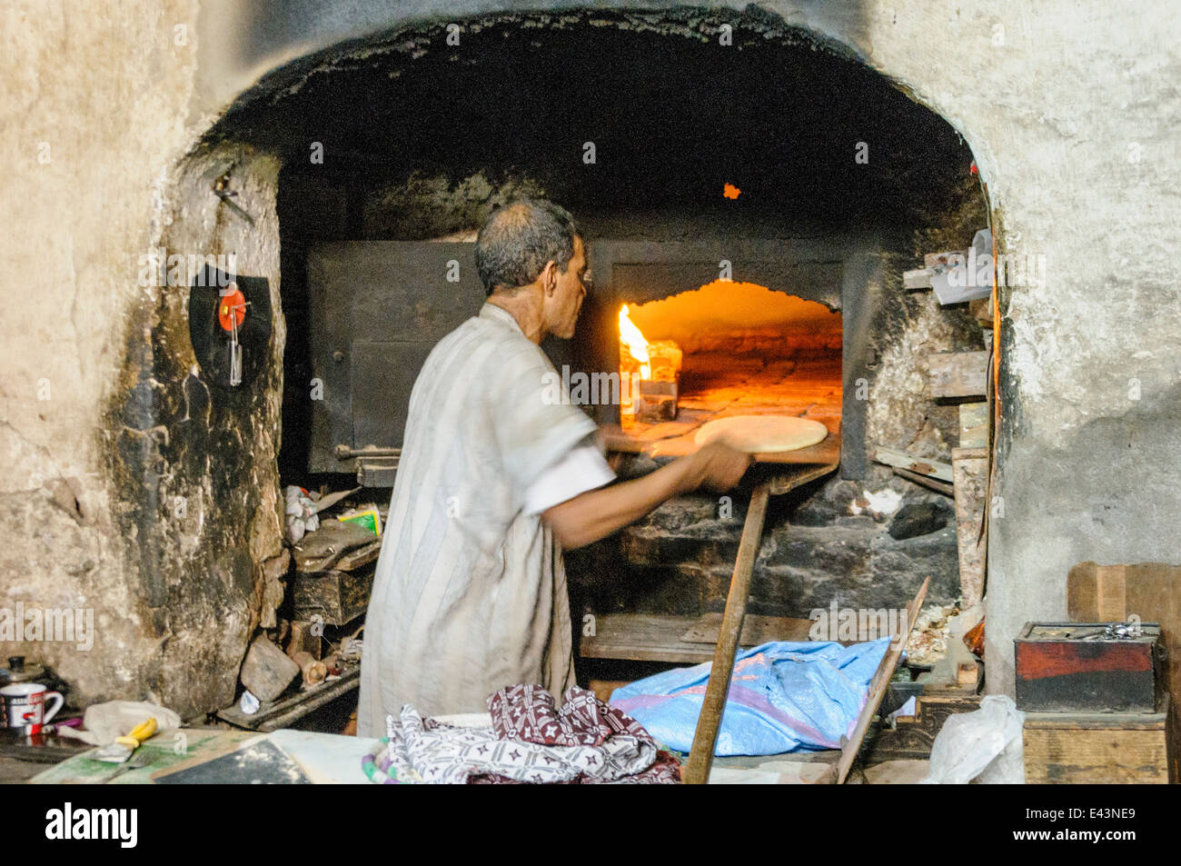 A traditional bakery in Marrakech, Morocco: people prepare their doughs ...