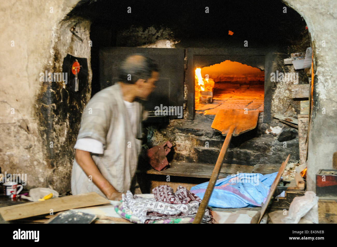 A traditional bakery in Marrakech, Morocco: people prepare their doughs ...