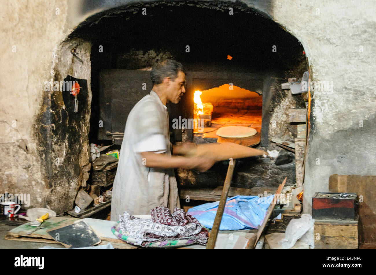 A traditional bakery in Marrakech, Morocco: people prepare their doughs ...