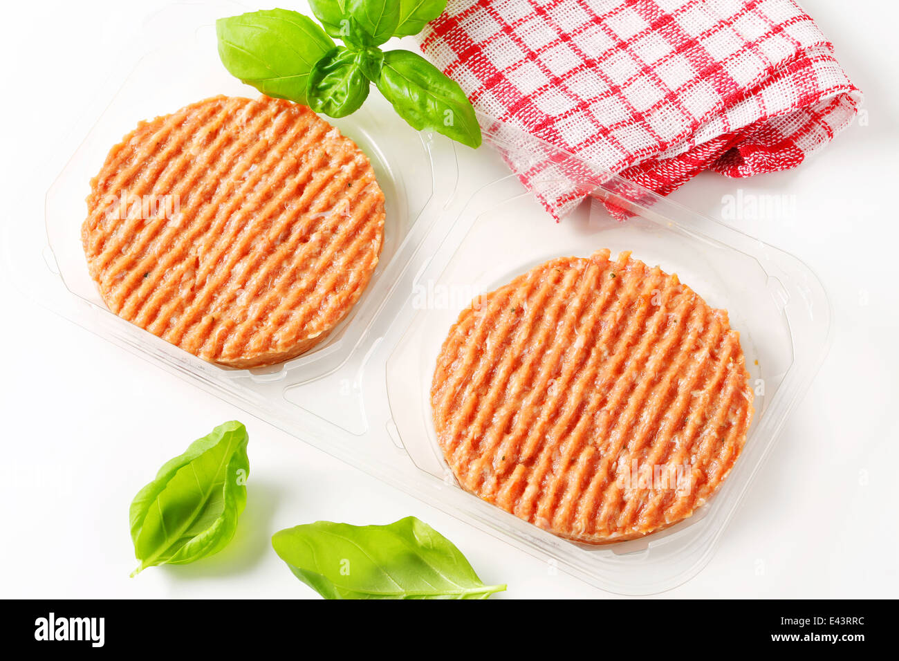 Raw burger patties in plastic packaging Stock Photo - Alamy