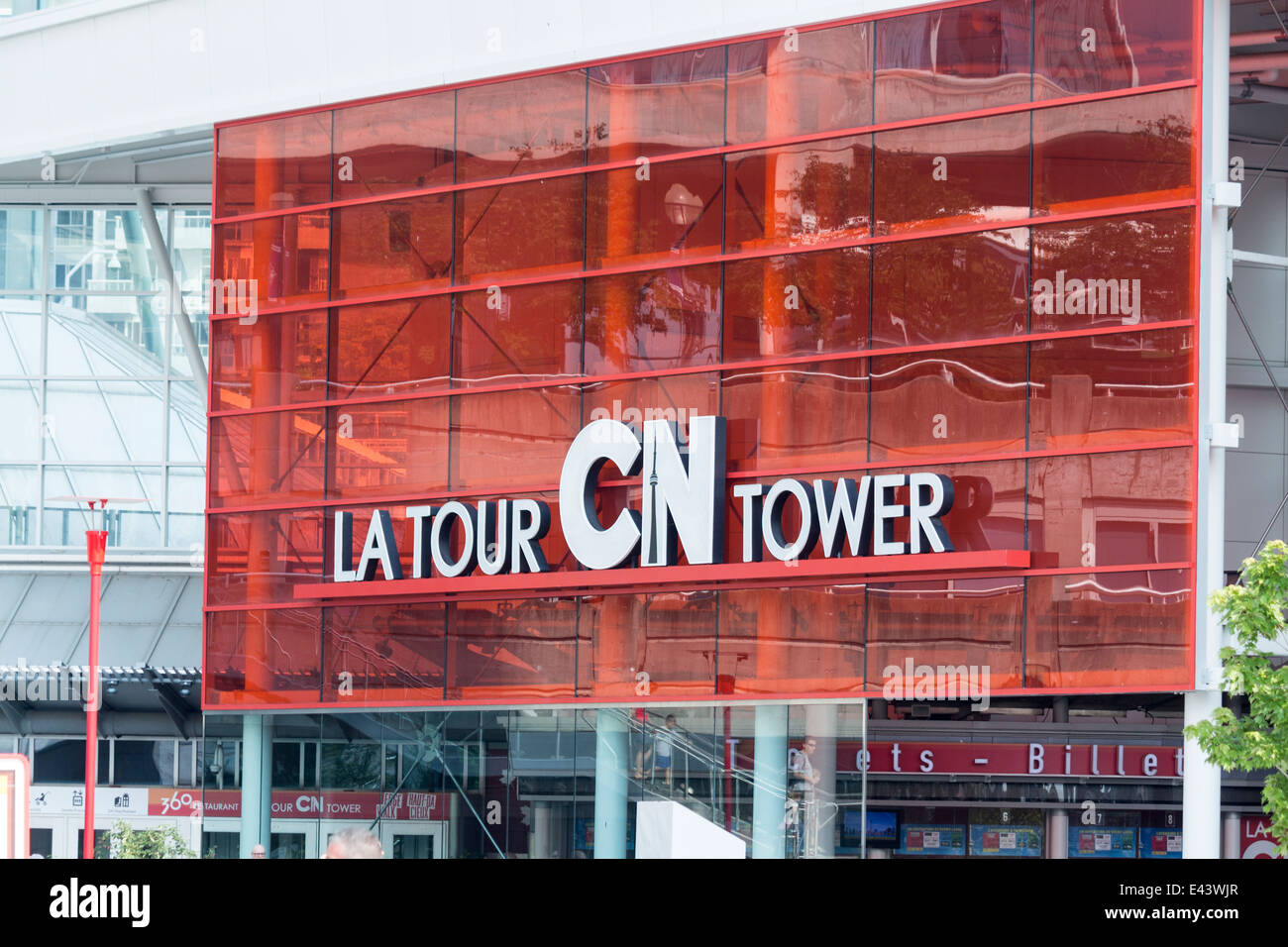 CN tower Sign at the entrance of the tower in red glass with the tower ...