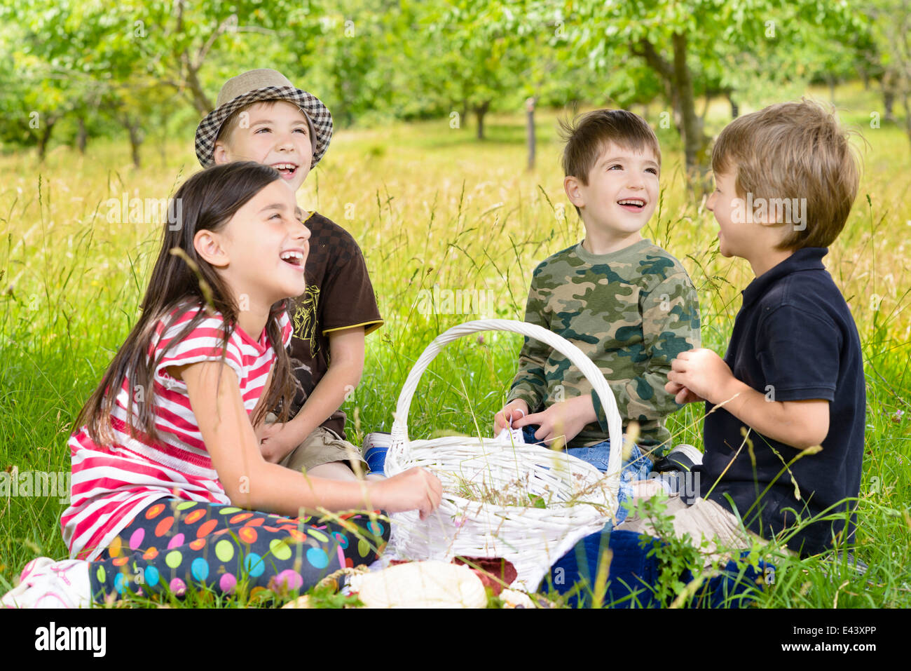 Four happy cute picnic in nature Stock Photo - Alamy