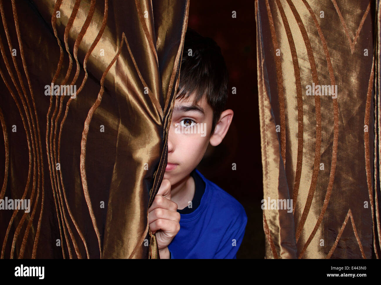 Child hiding behind curtain hi-res stock photography and images - Alamy