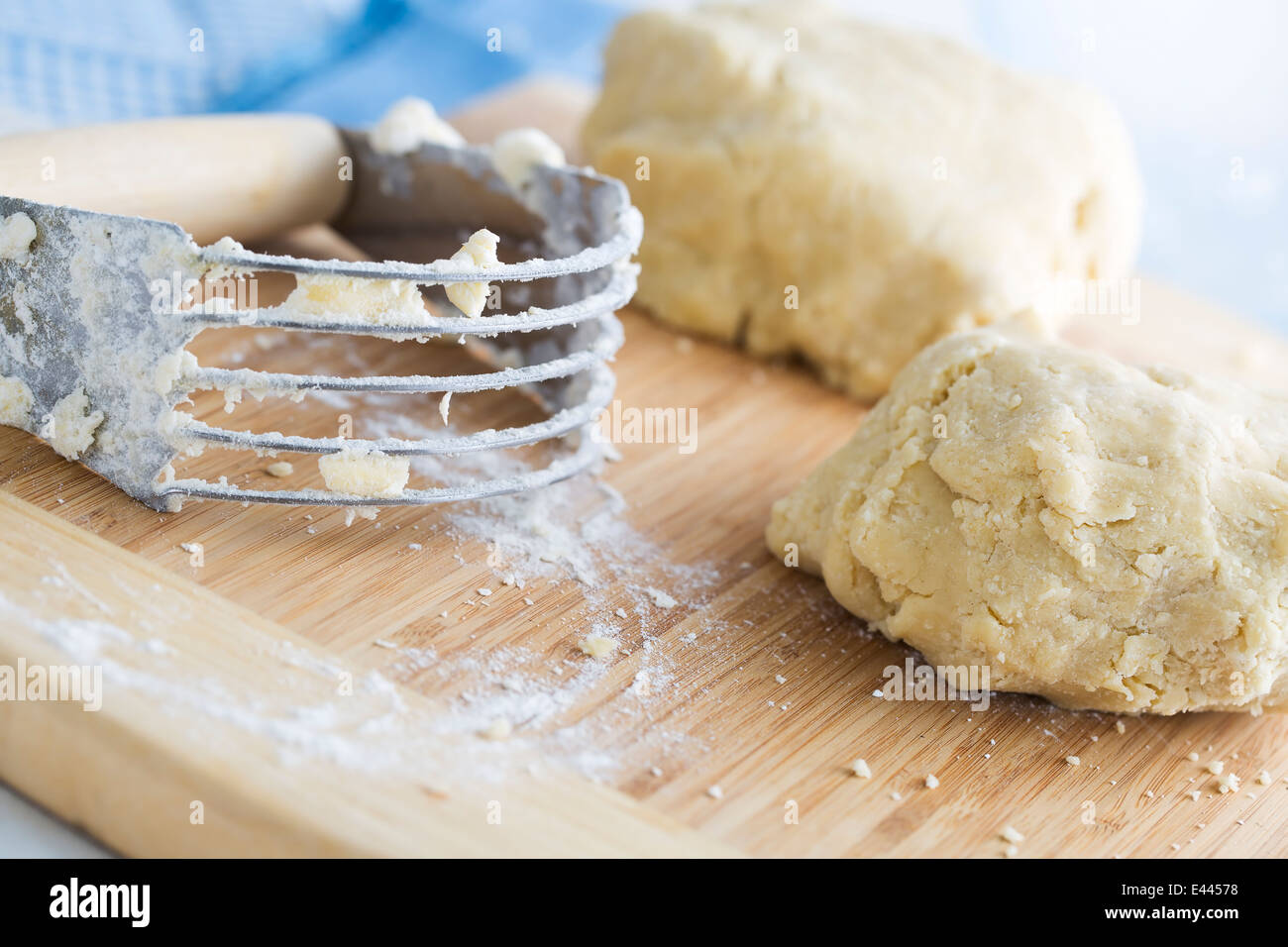 Dough and hand held pastry blender on cutting board Stock Photo - Alamy
