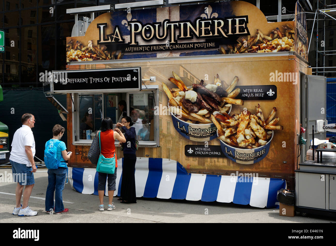 People lined up to order Quebec poutine from a food truck in downtown ...