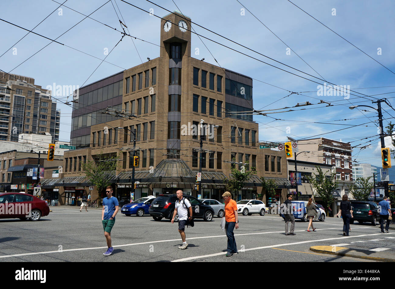 Pedestrians crossing the busy corner of Broadway and Granville streets ...