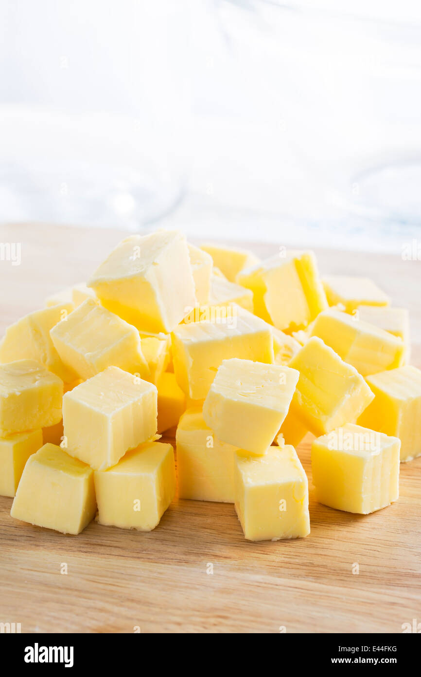 Fresh cubes of butter on board Stock Photo - Alamy