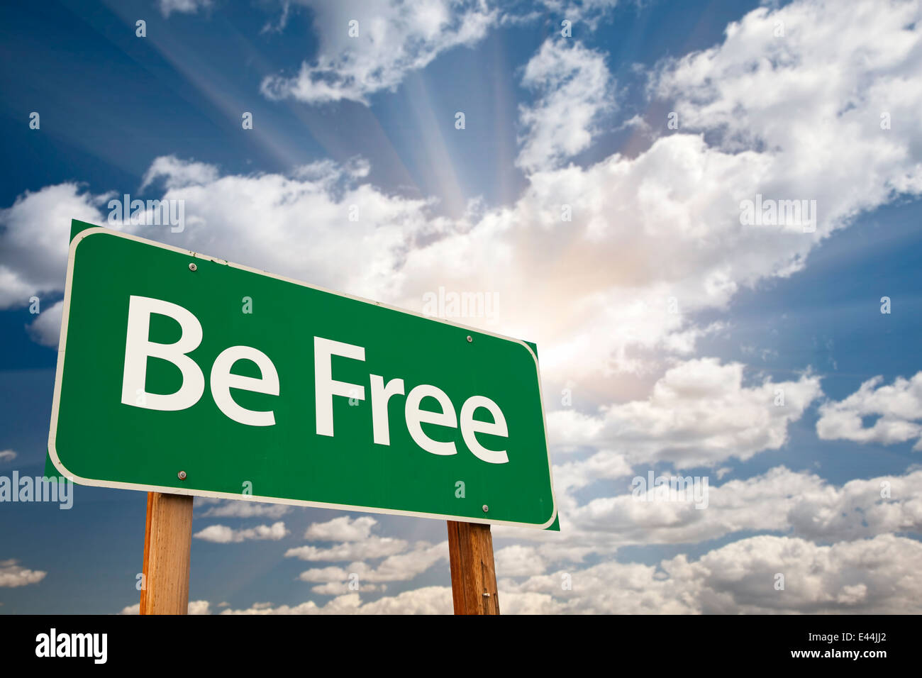 Be Free Green Road Sign with Dramatic Clouds and Sky Stock Photo - Alamy