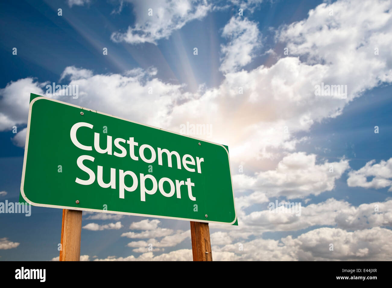 Customer Support Green Road Sign with Dramatic Clouds and Sky Stock ...