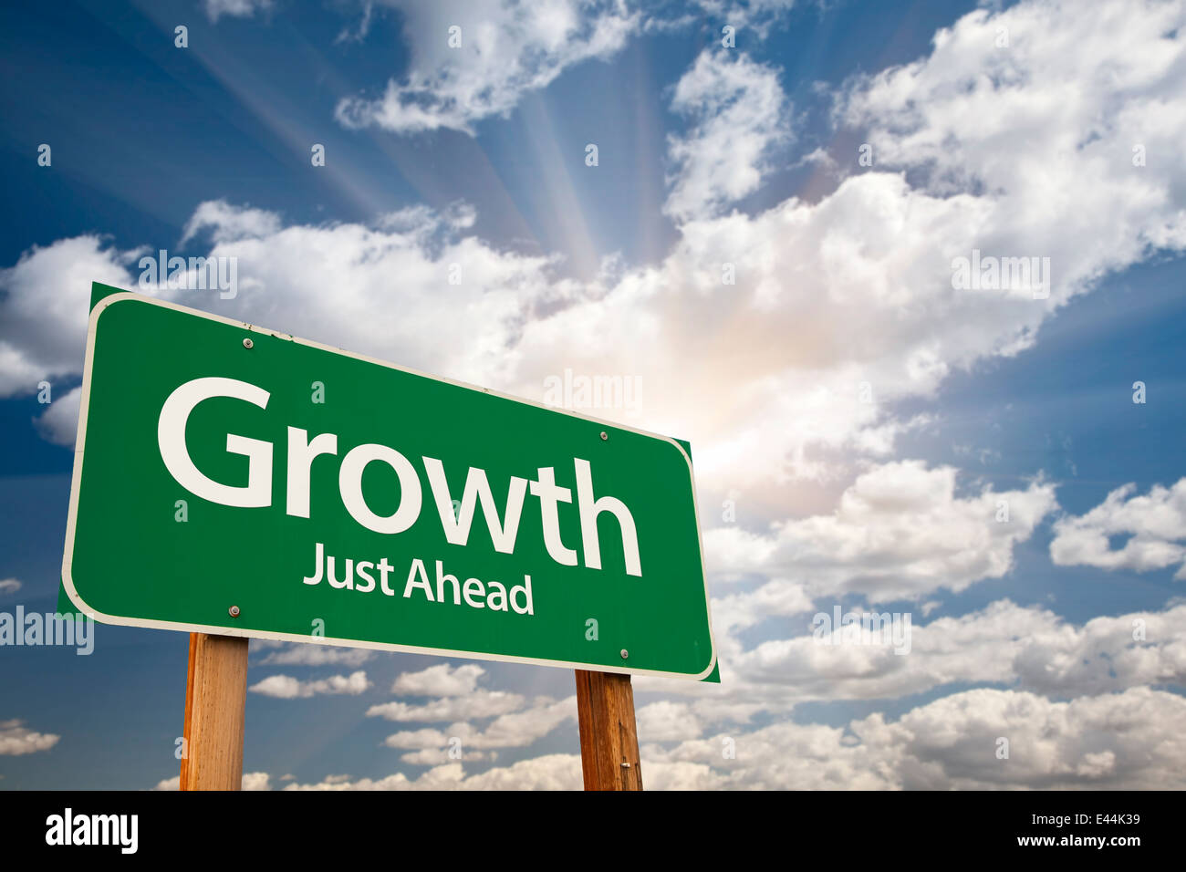 Growth Green Road Sign with Dramatic Clouds and Sky Stock Photo - Alamy