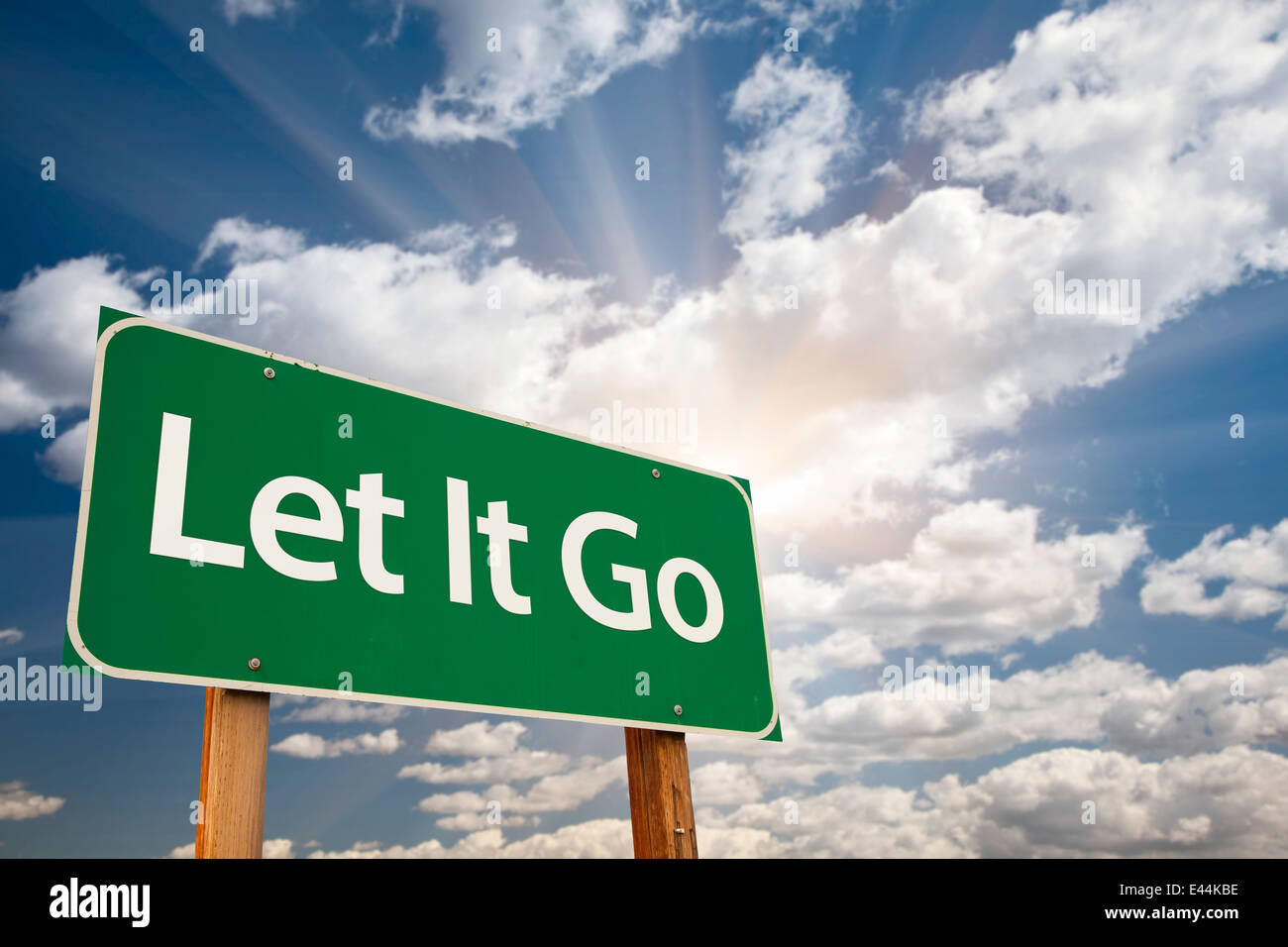 Let It Go Green Road Sign with Dramatic Clouds and Sky Stock Photo - Alamy
