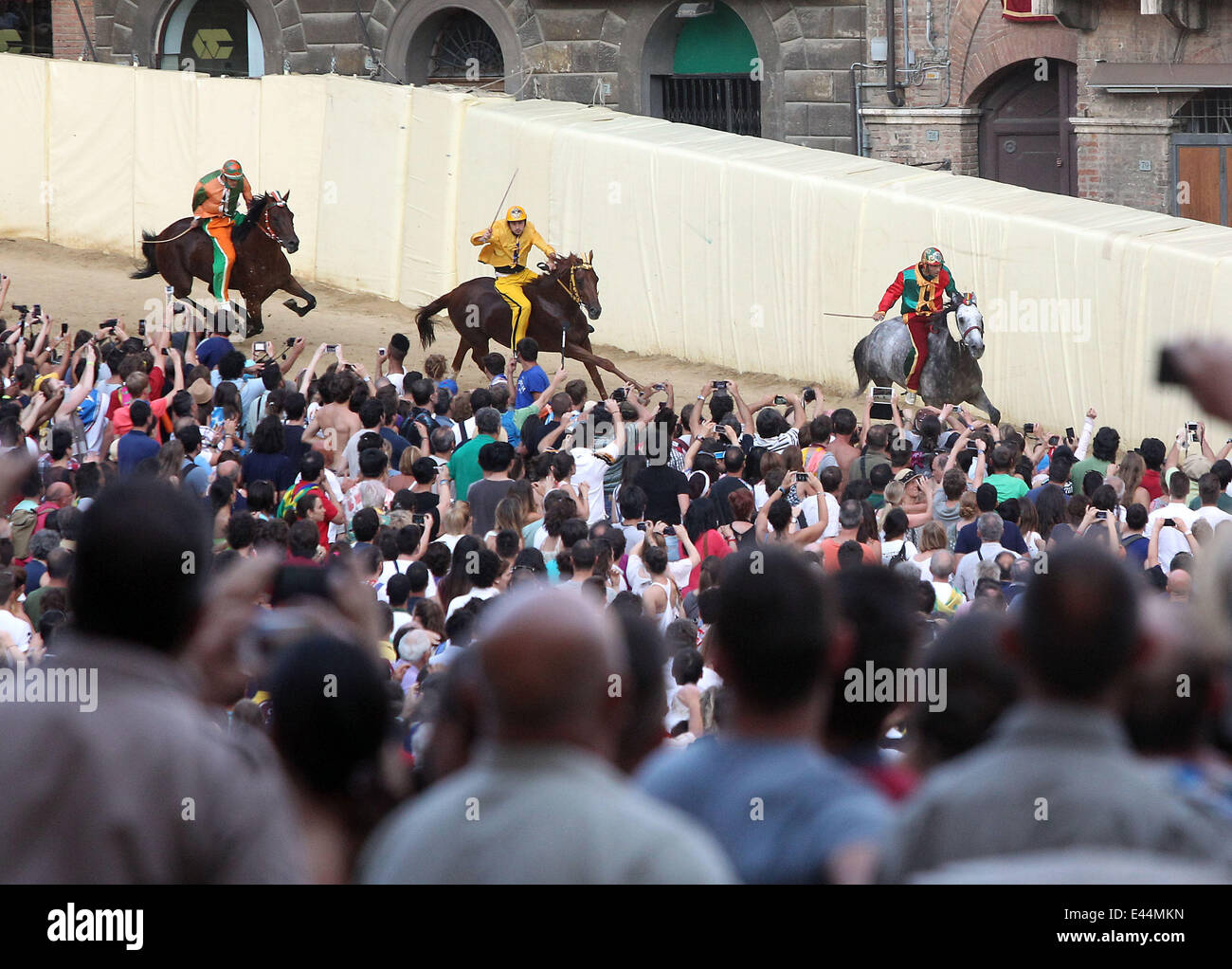 Siena, Italy. 2nd July, 2014. Jockeys and their horses compete during ...
