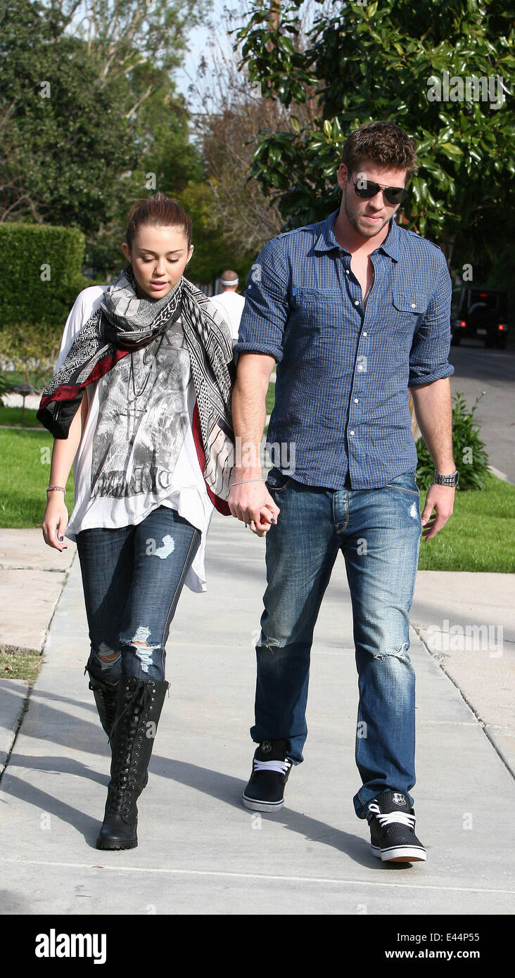 Miley Cyrus and her boyfriend Liam Hemsworth out walking in Toluca Lake ...