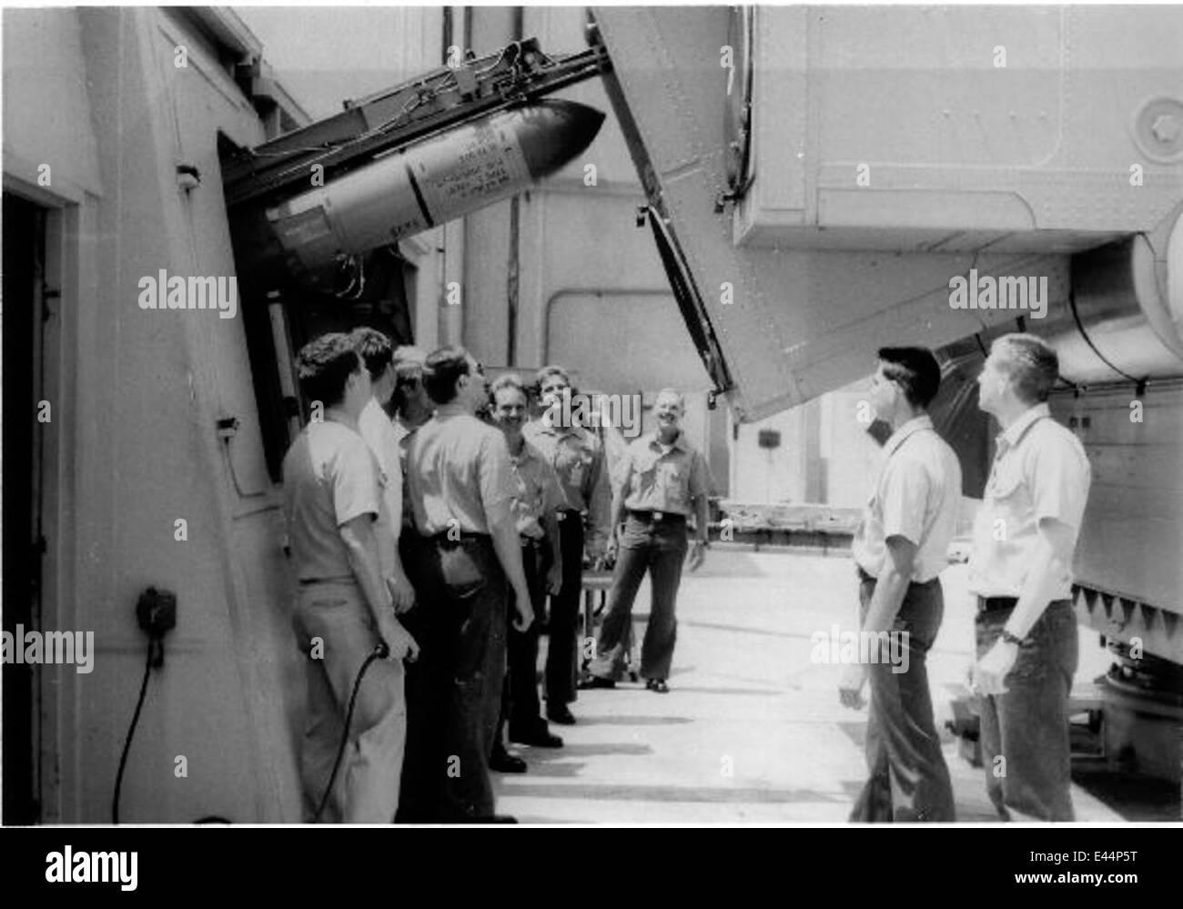 This photograph depicts the loading of an Anti-Submarine Rocket (ASROC ...