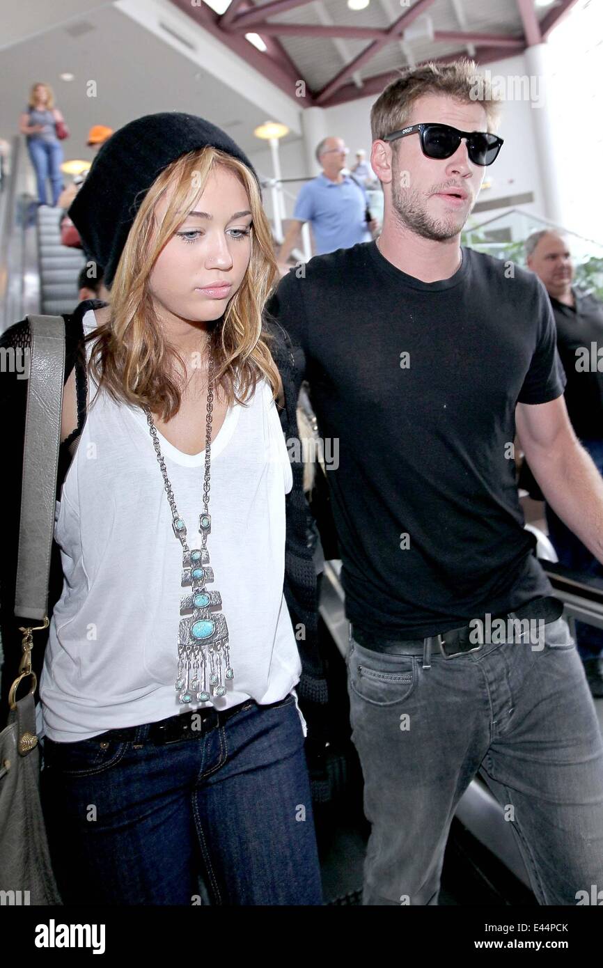 Miley Cyrus and Liam Hemsworth Miley Cyrus arrives at LAX airport on a ...