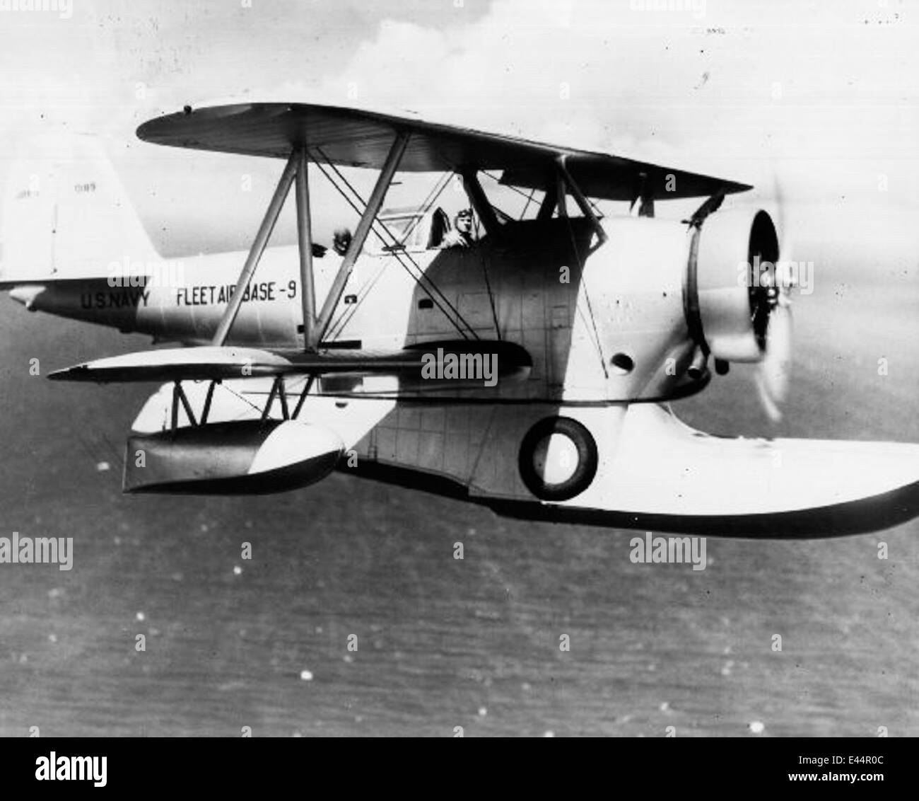 The J2F-1, a versatile amphibious biplane, is captured in flight in ...