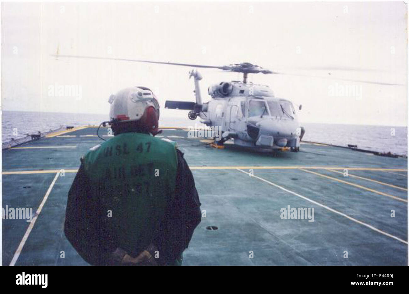 An HSL-47 SH-60B Seahawk helicopter, prepared for takeoff, highlighting ...