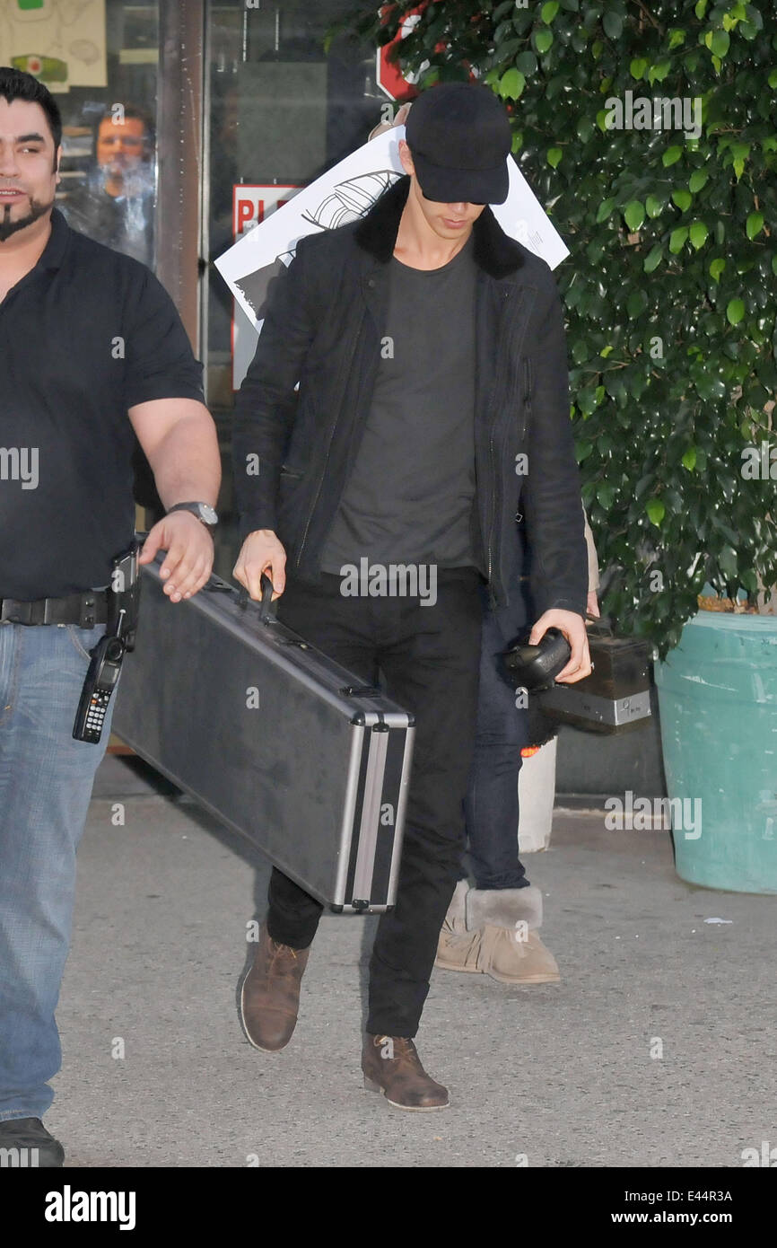 Austin Butler exits a gun range along with his girlfriend Van Nuys ...