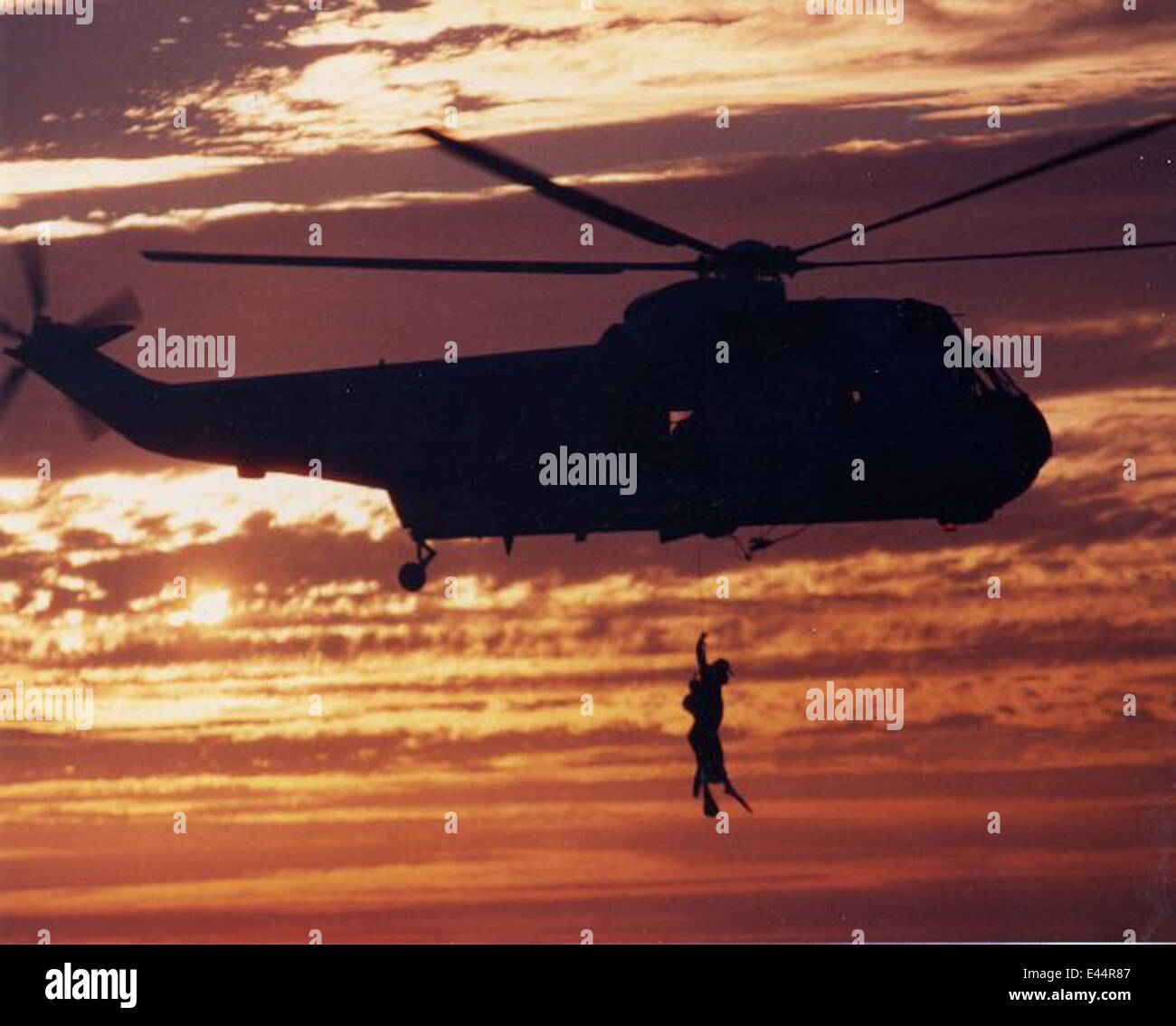 Photograph of an SH-3 Sea King helicopter in a military search and ...