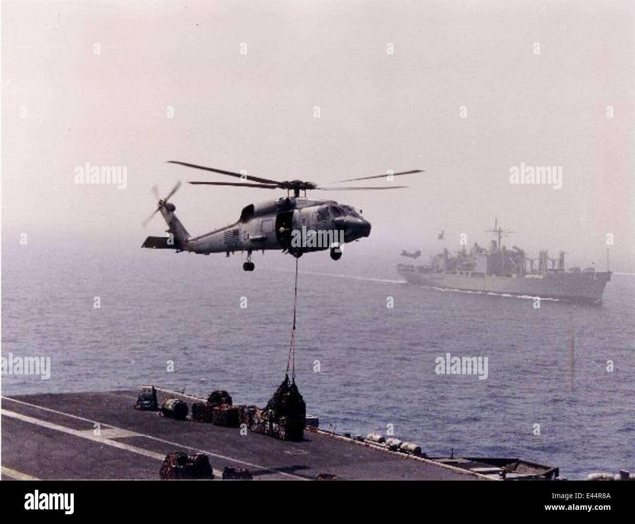 A photograph of a U.S. Navy HH-60H Seahawk helicopter performing a ...