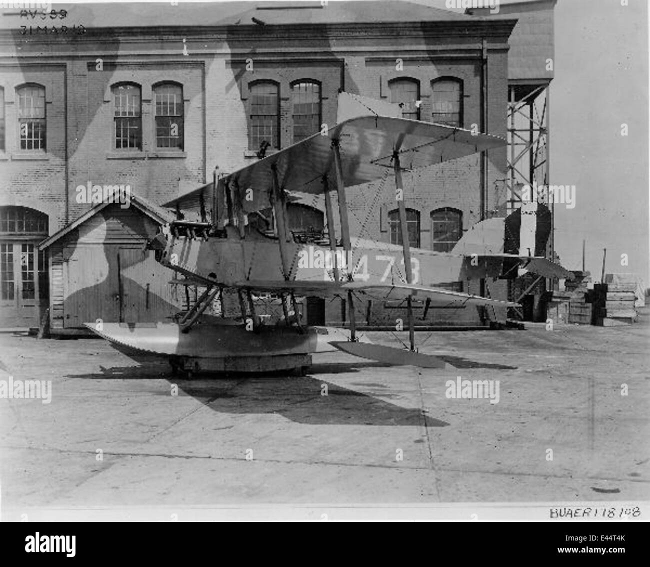 A Curtiss N9H biplane in flight, with the image highlighting the ...