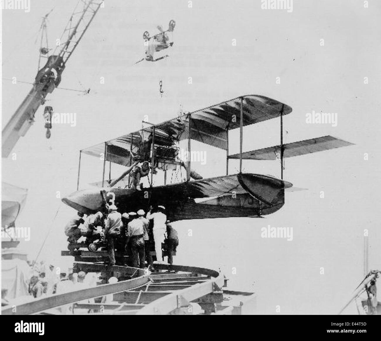 The Curtiss AB3, a biplane aircraft, is launched from a catapult aboard ...