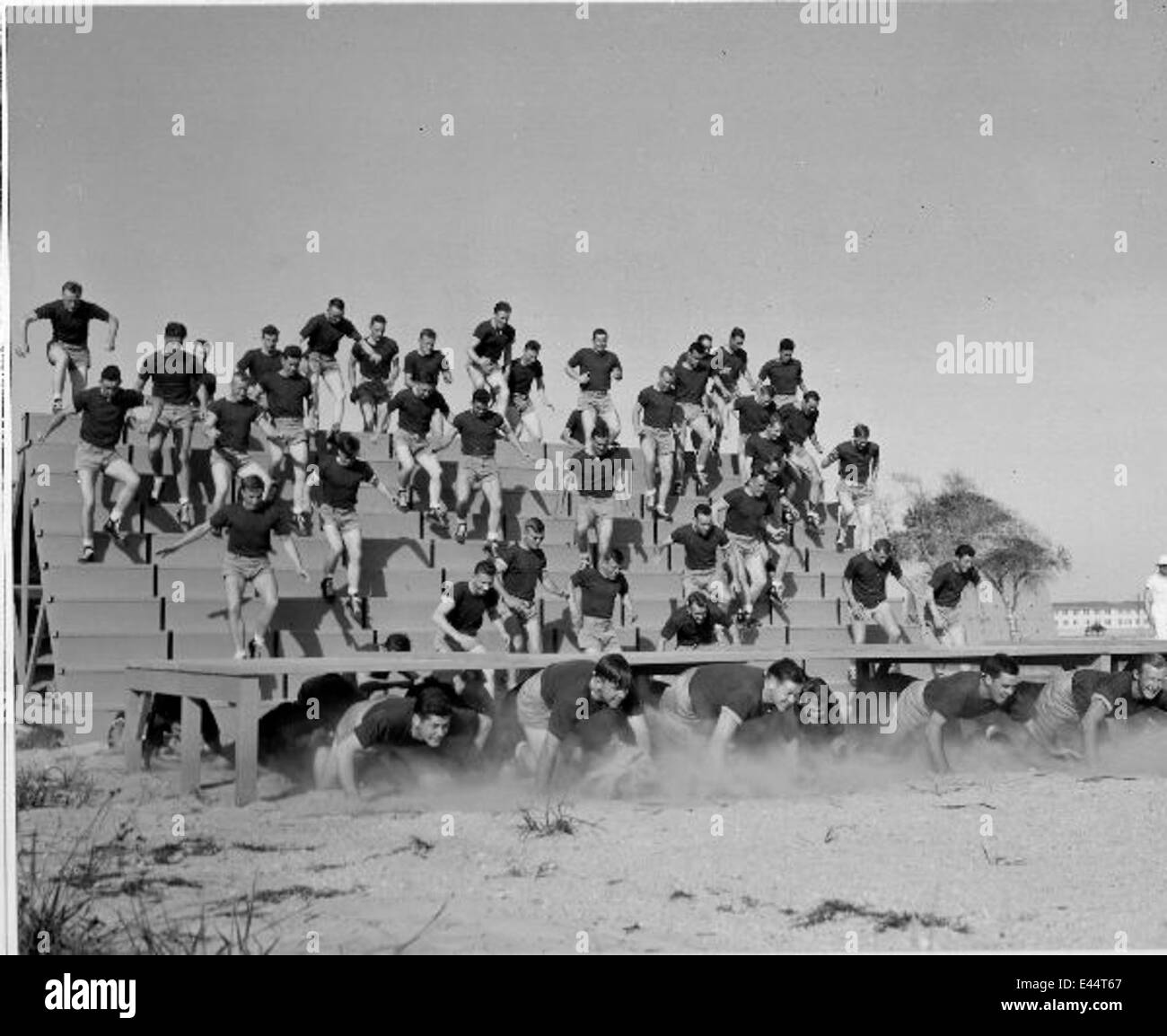 A historical photograph showing the construction of a military obstacle ...