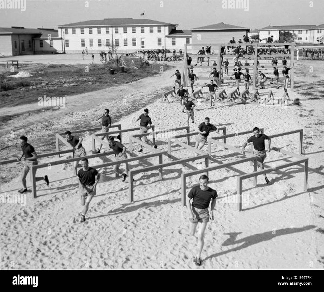 A photograph of cadets navigating an obstacle course, focusing on their ...