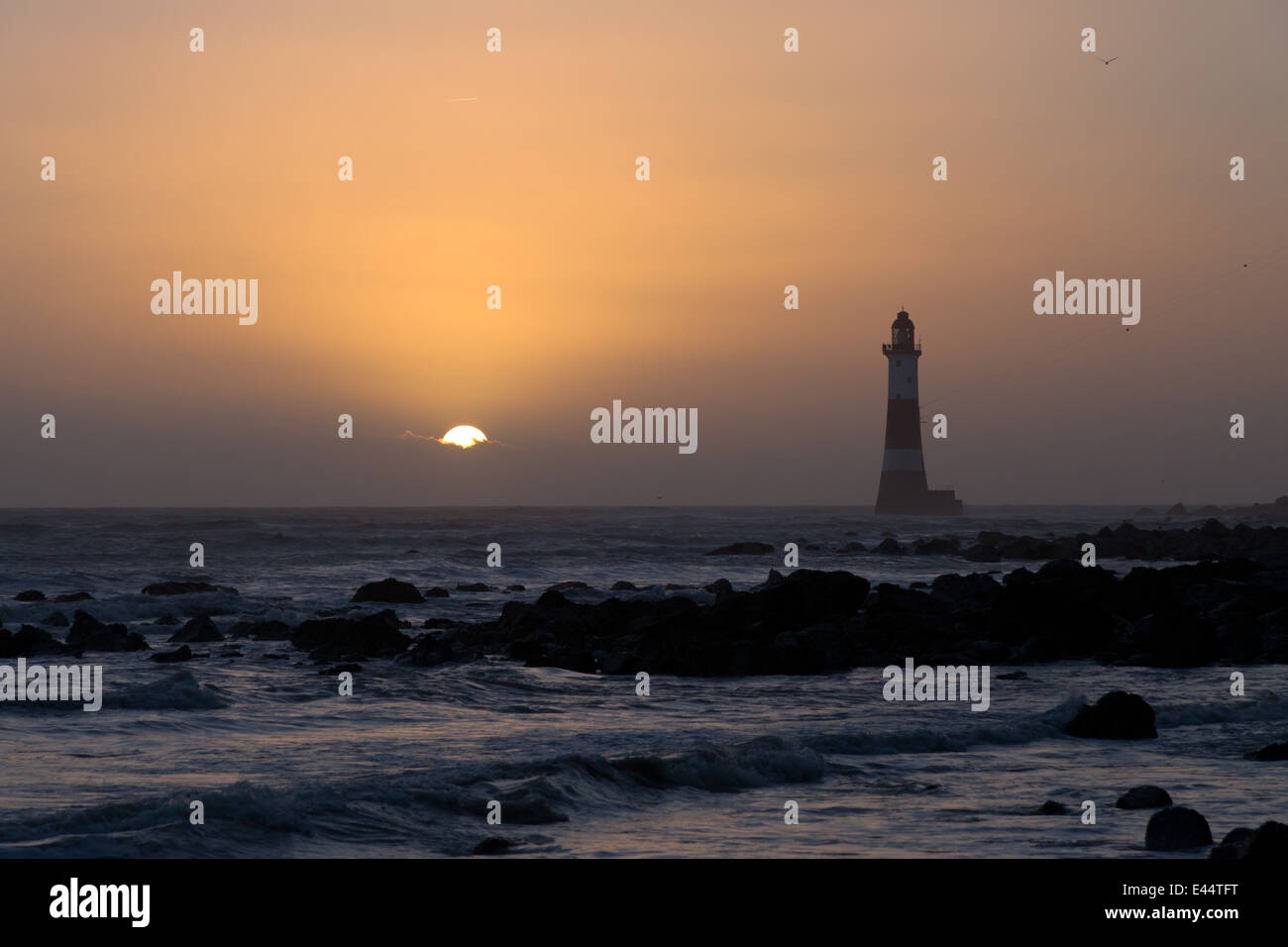 Lighthouse with sunset and ocean at Beachy Head, East Sussex Stock ...
