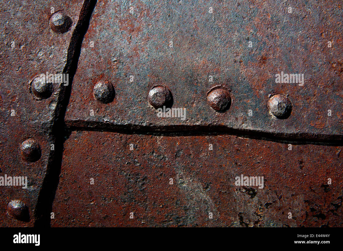 Dark red rusty tank and rivets Stock Photo - Alamy