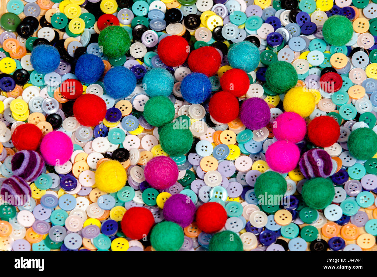 sewing textile buttons and made of felt ball background Stock Photo - Alamy